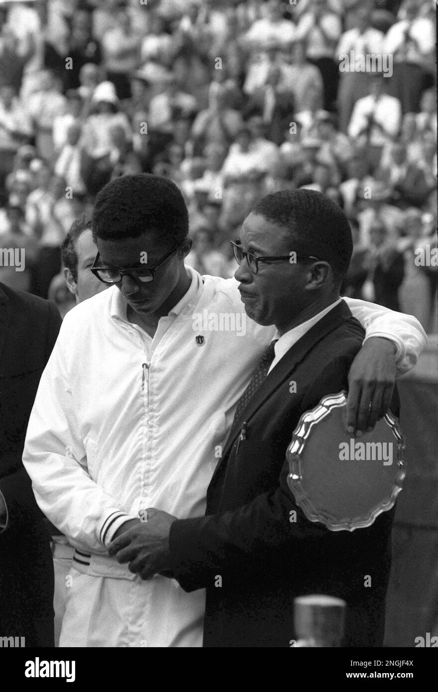 Arthur Ashe holds his trophy for the U.S. Open singles tennis ...