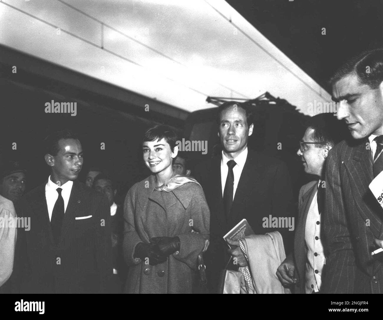 Actor Mel Ferrer and Actress Audrey Hepburn walk from train which ...