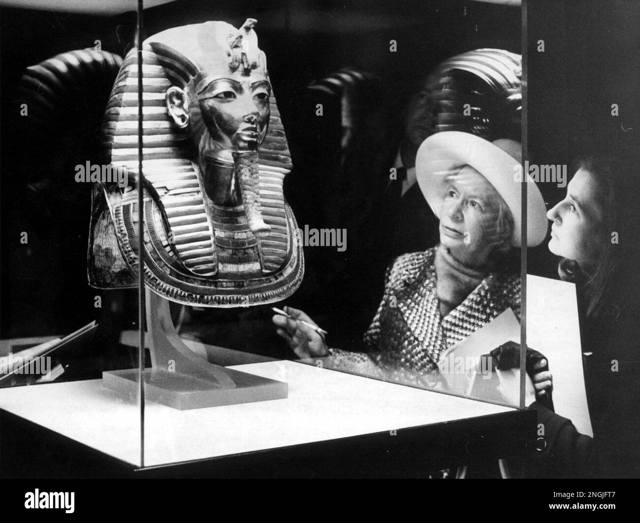 People admire the gold mask of King Tutankhamun of Egypt, at the ...