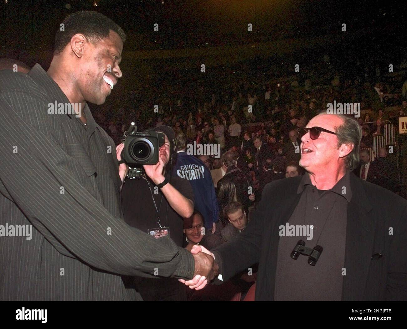 New York Knicks' Patrick Ewing, left, and actor Jack Nicholson shake ...