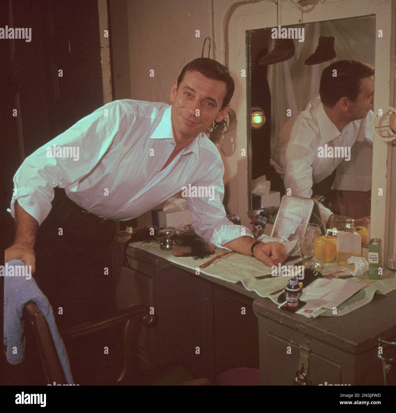 French actor and singer Yves Montand poses in his dressing room at the ...