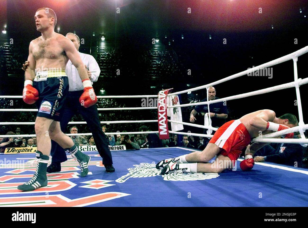 German boxer Sven Ottke, left, is lead away by the referee after ...