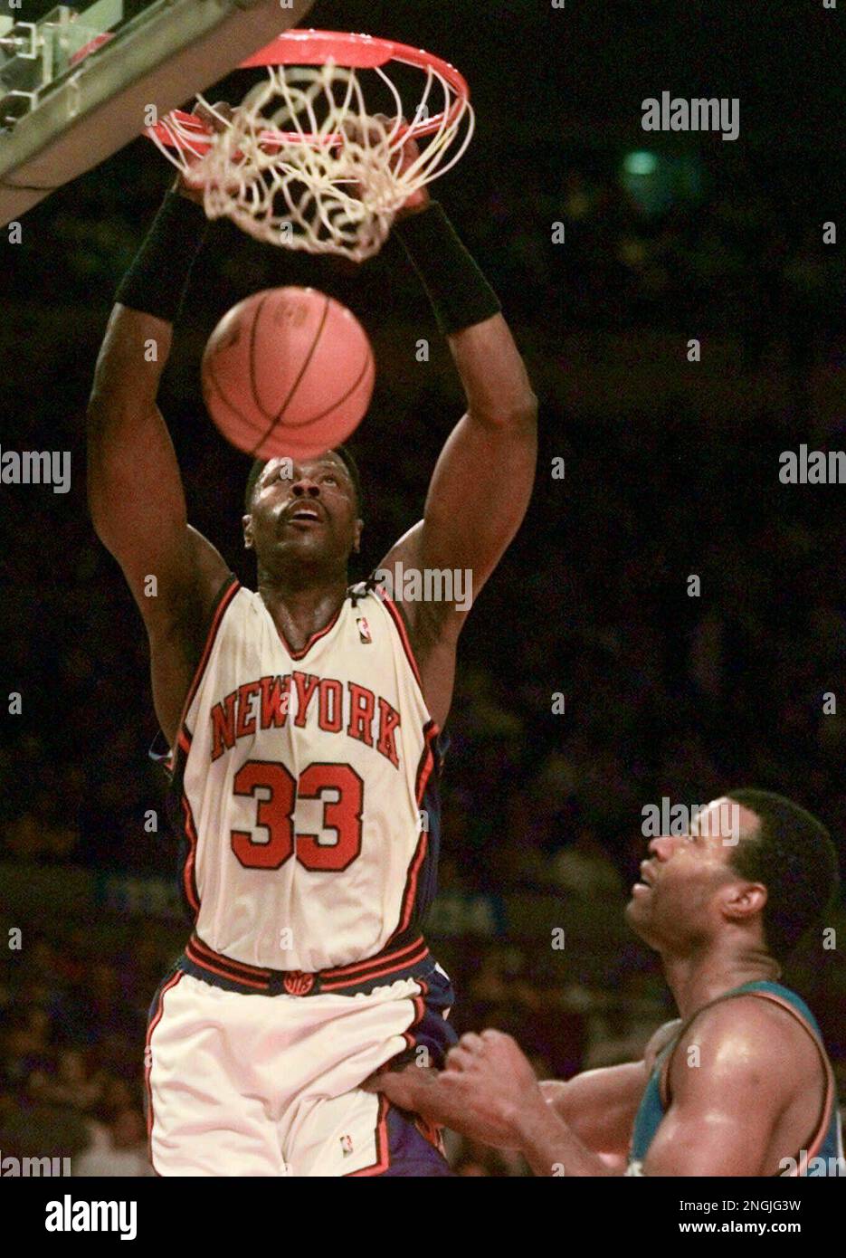 New York Knicks' Patrick Ewing (33) jams for two-points in front of ...