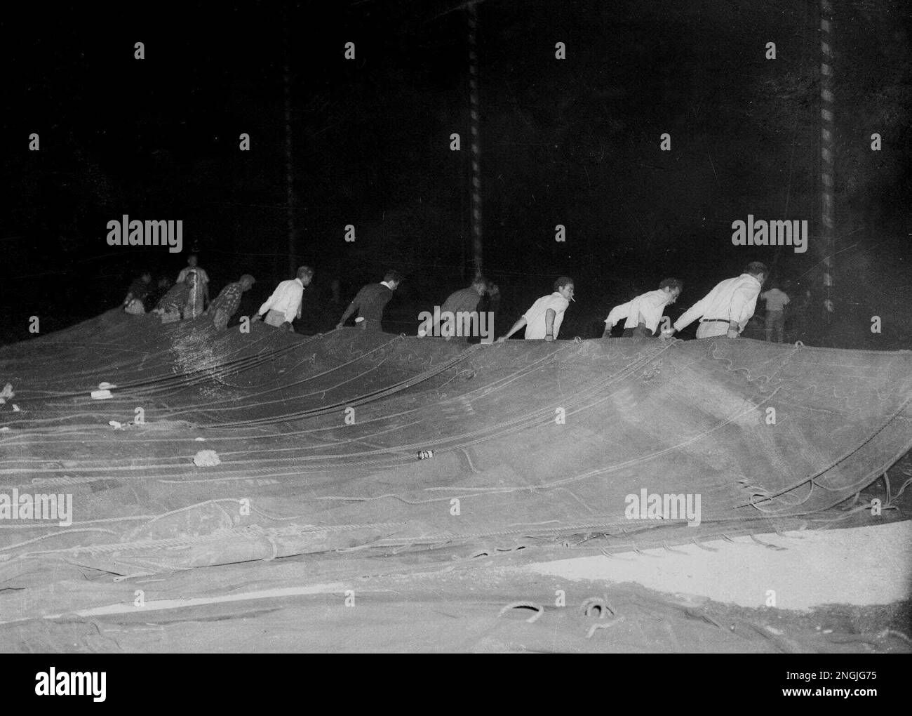 Workmen pull away the "big top" of the Ringling Bros. and Barnum ...