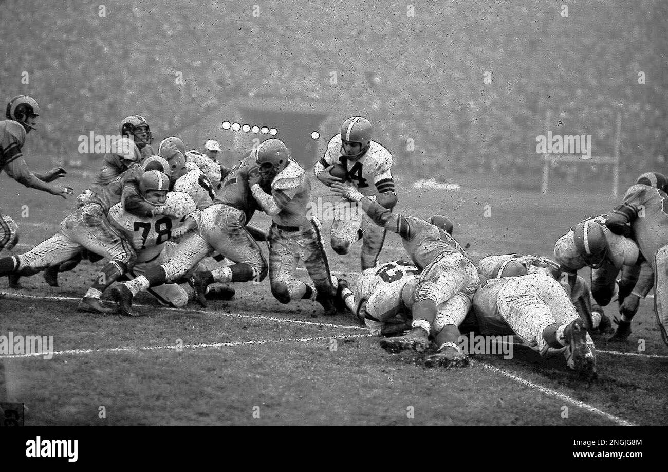 Cleveland Browns' quarterback Otto Graham goes over from the one yard ...