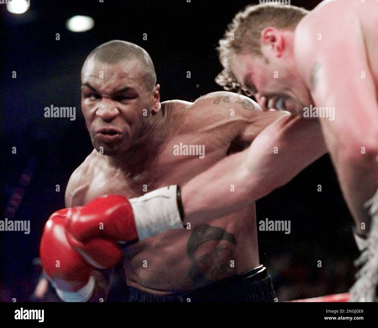 Francois Botha, right, of South Africa, throws a right hook as ...