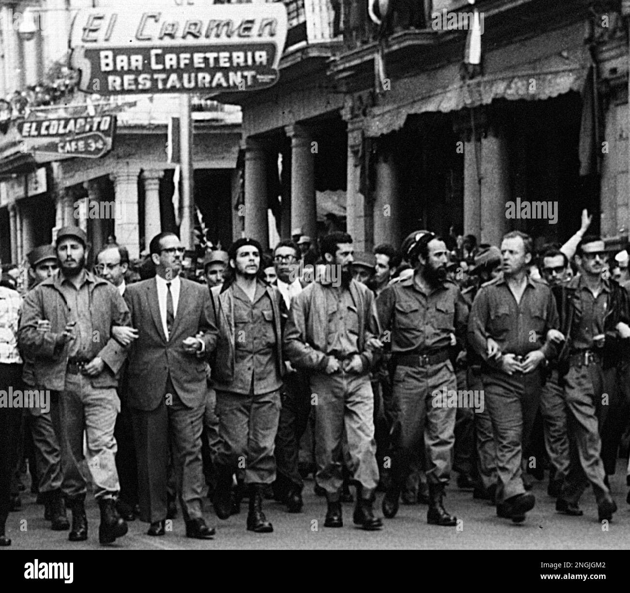 Cuban leaders walk arm-in-arm at the head of the March 5, 1960 funeral ...