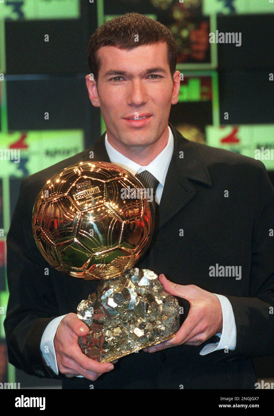 French soccer player Zinedine Zidane smiles with his Golden Ball trophy ...