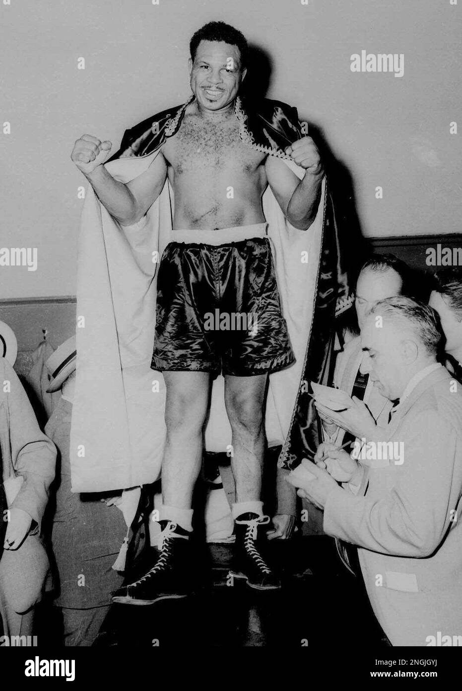 World light-heavyweight champion Archie Moore strikes a pose atop a ...