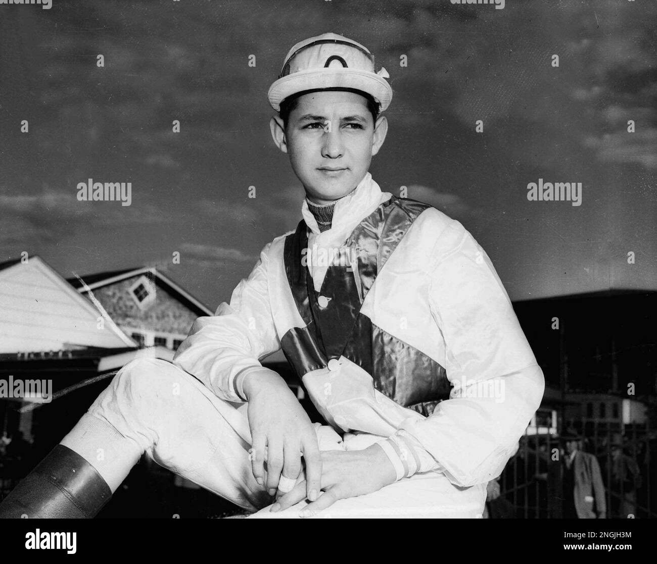Trainer Clarence Picou poses at the Bowie, Maryland racetrack in 1948 ...