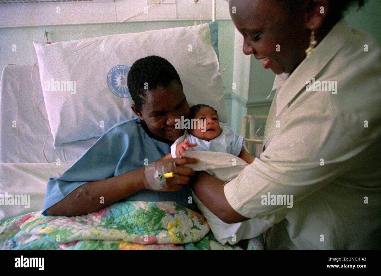 Catherine Bwire is handed her daughter Jean Bahati Lukhoba for the ...