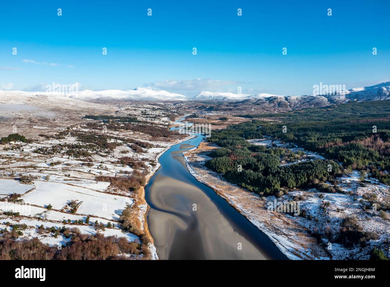 Aerial view of snow covered Gweebarra River between Doochary and ...