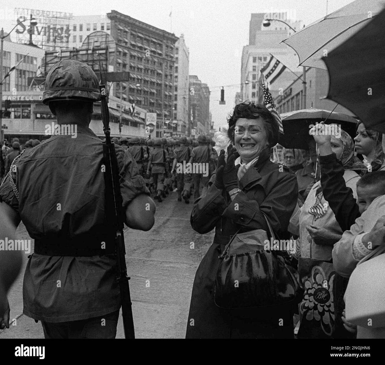 A woman is overcome by emotion as soldiers of the U.S. Army's 3rd ...