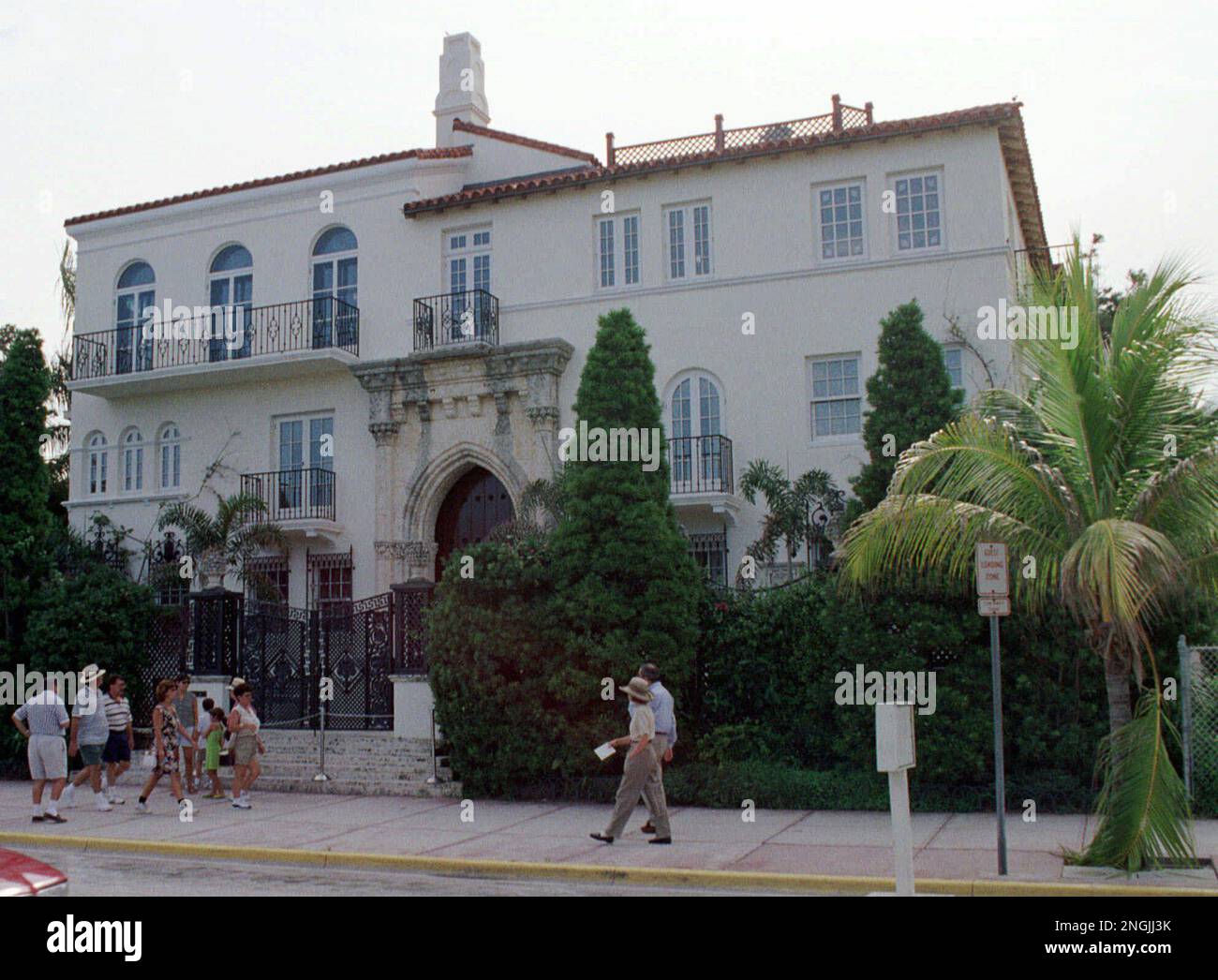 Tourists walk by Italian designer Gianni Versace's mansion on Ocean ...
