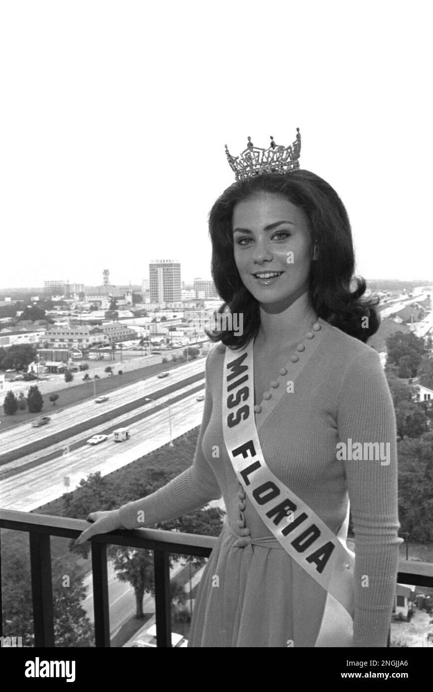 Delta Burke, 17, of Orlando poses with her city's skyline behind her on ...