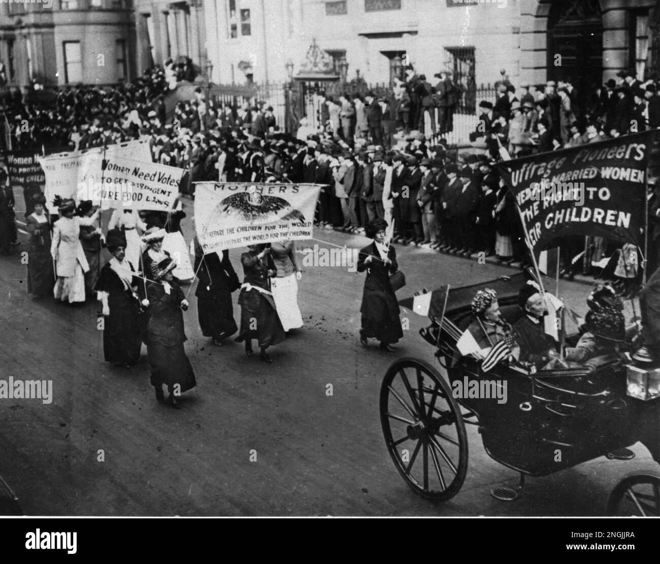 Miss Alice Paul, in background holding rolled-up banner, was part of ...
