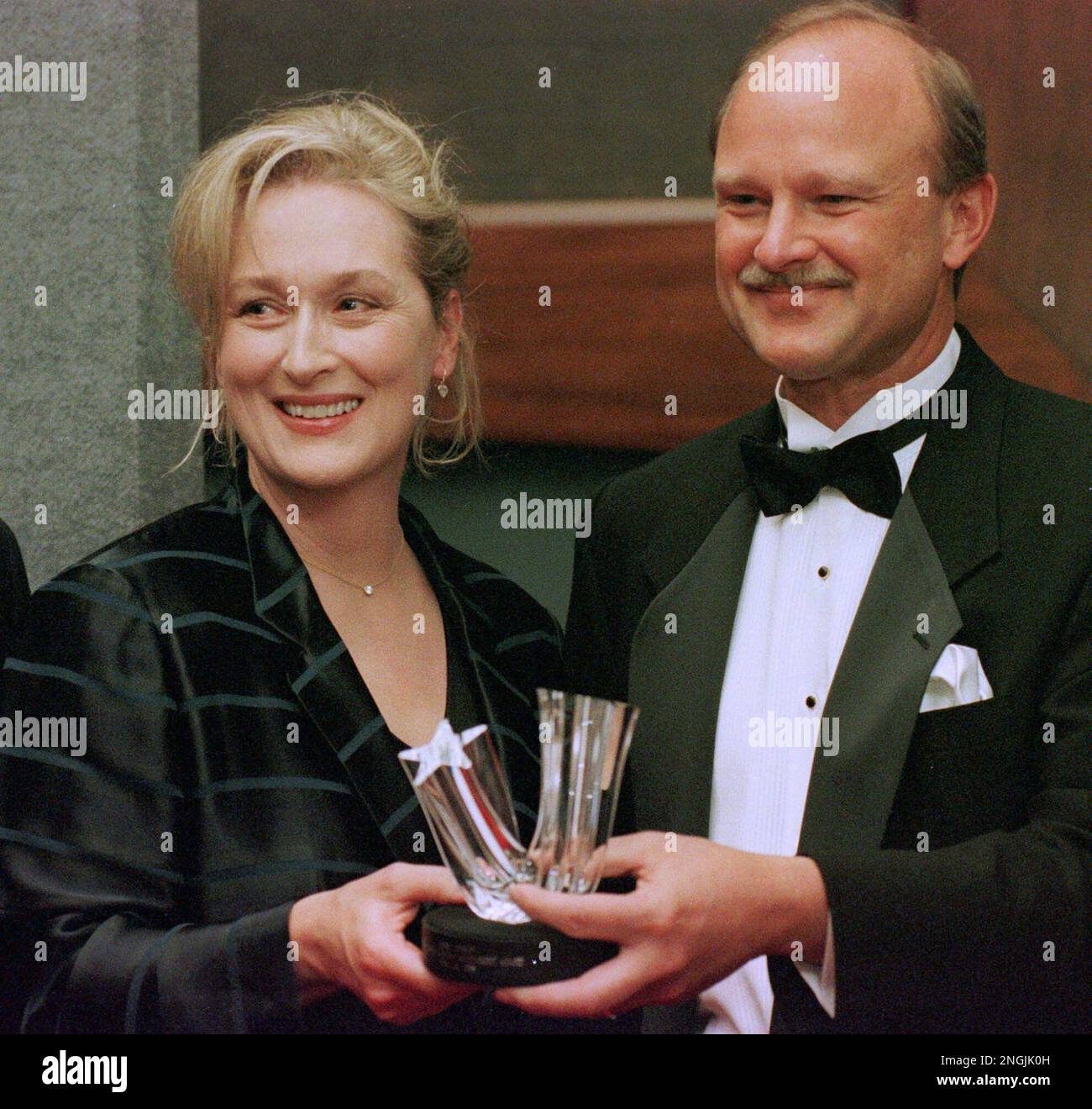 Actress Meryl Streep, left, is presented the Bette Davis Lifetime Achievement Award by Michael ...