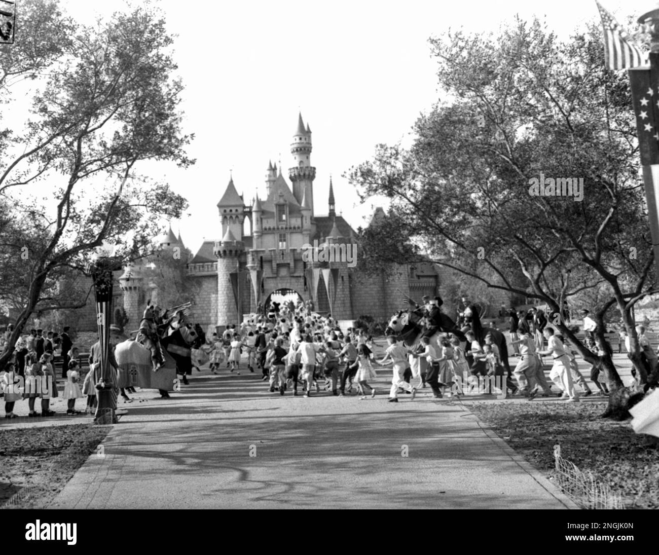Children sprint across a drawbridge and into the castle that marks the ...