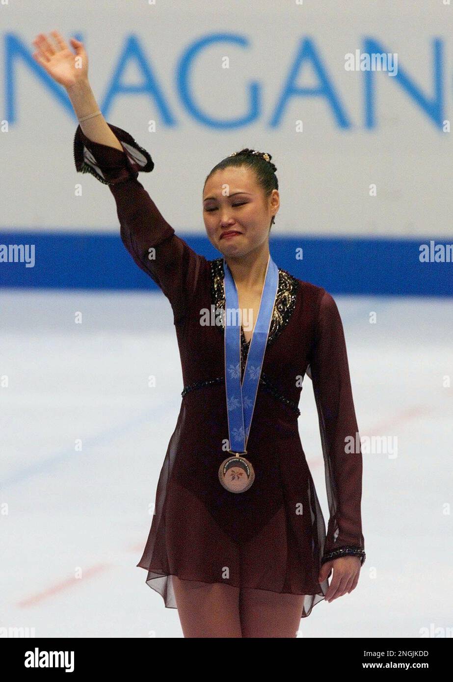 China's Lu Chen acknowledges the crowd during the awarding ceremony following the ladies free ...