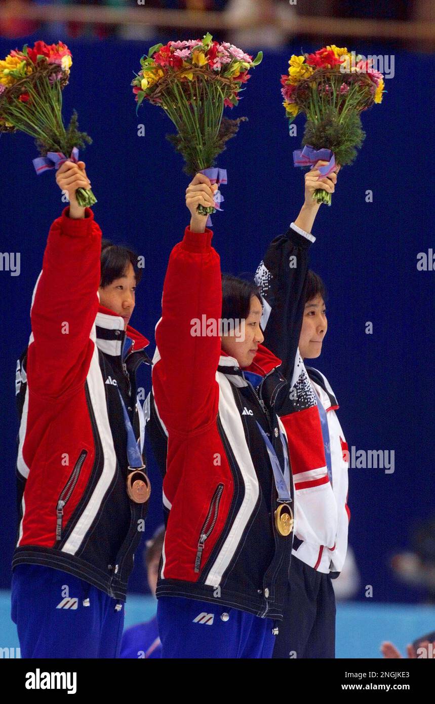 Medalists in the women's short track 1000 meter race wave to the crowd ...
