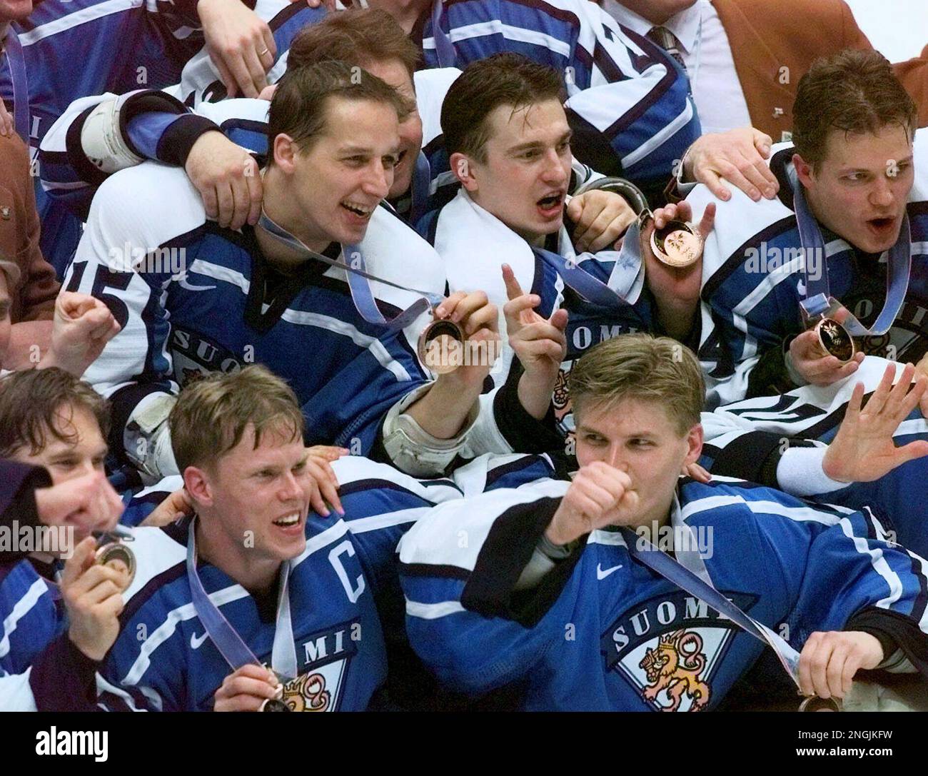 Finland Olympic players show off their medals in jubilation of their ...