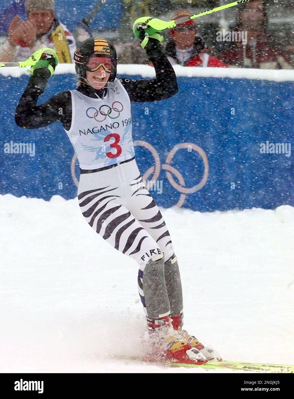 Germany's Katja Seizinger celebrates as she takes the gold medal in the ...