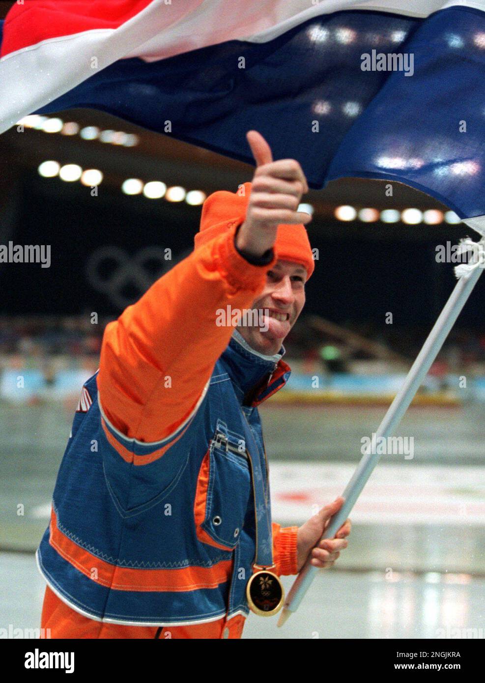 Netherland's Ids Postma sticks his tongue out during his victory lap ...