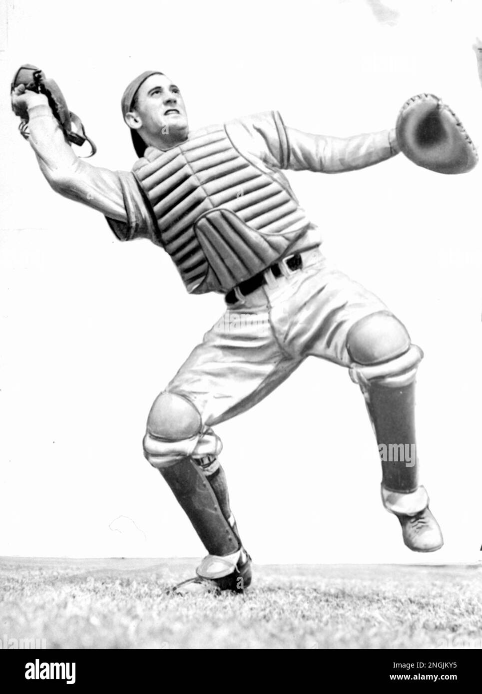 Al Lopez, Boston Bee catcher, rips off his catcher's mask in this posed ...