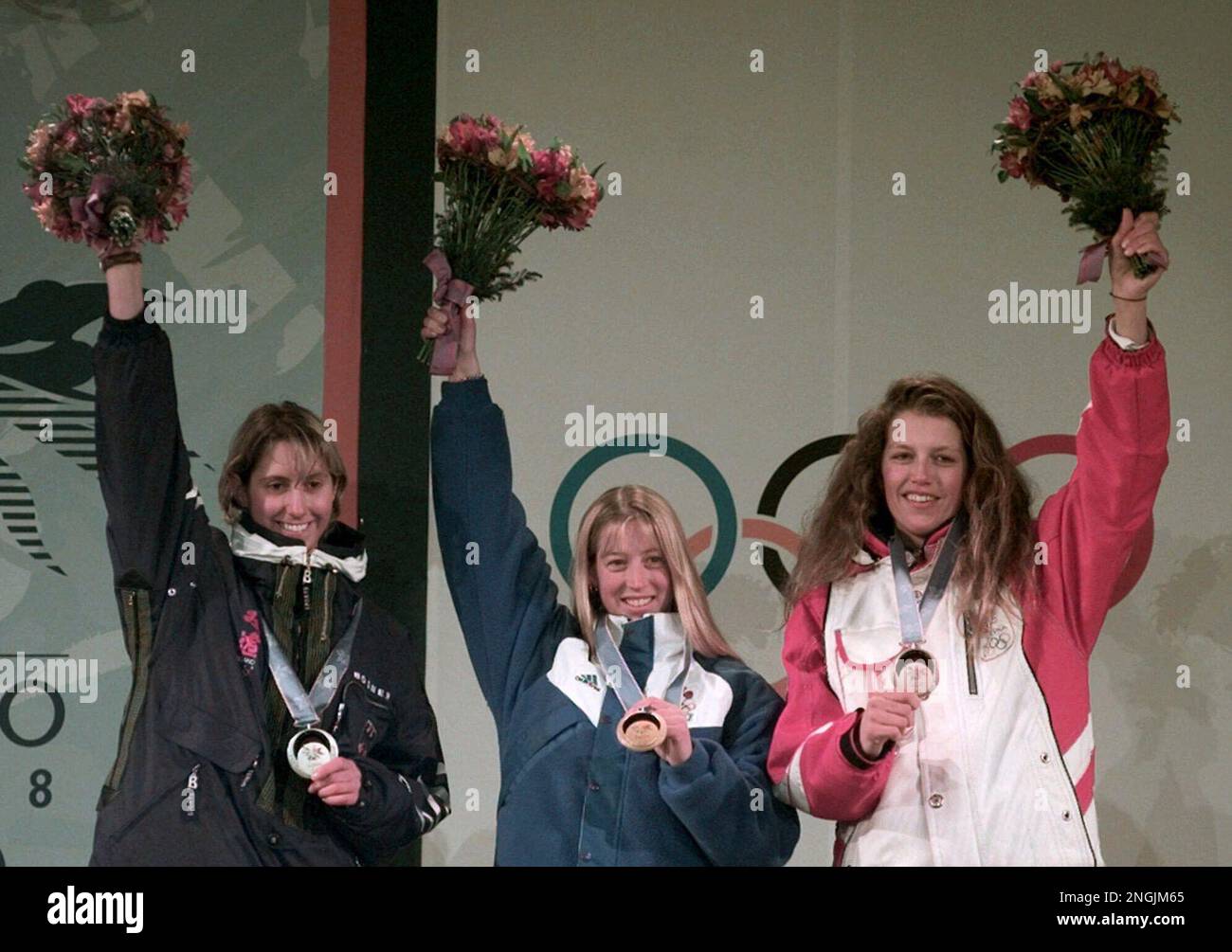 Gold medalist Karine Ruby, of France, center, silver medalist Heidi Renoth, of Germany, left ...