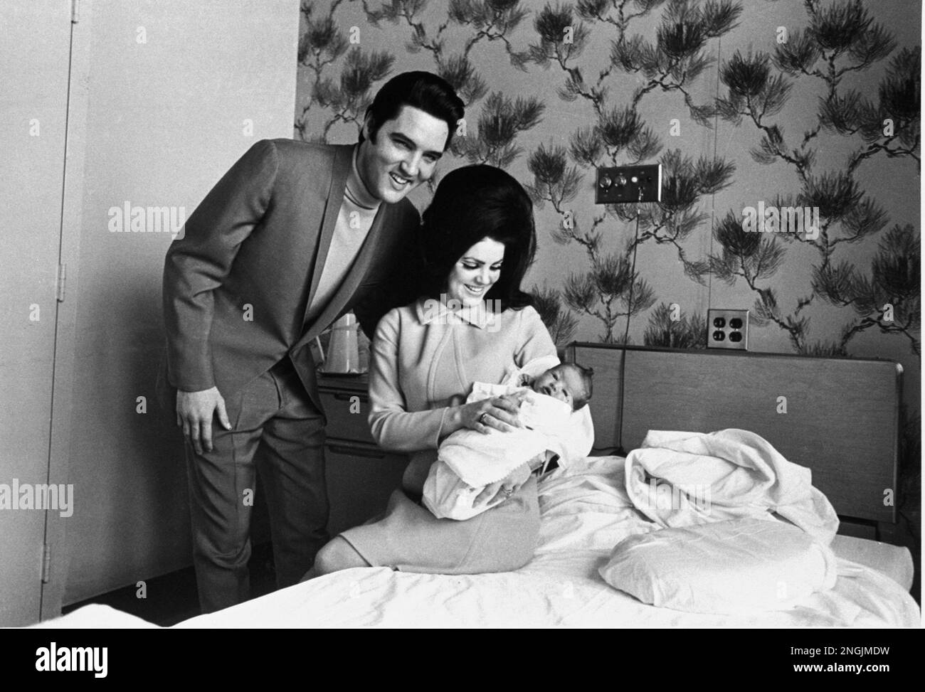 Lisa Marie Presley poses for her first picture, safe in the lap of her ...