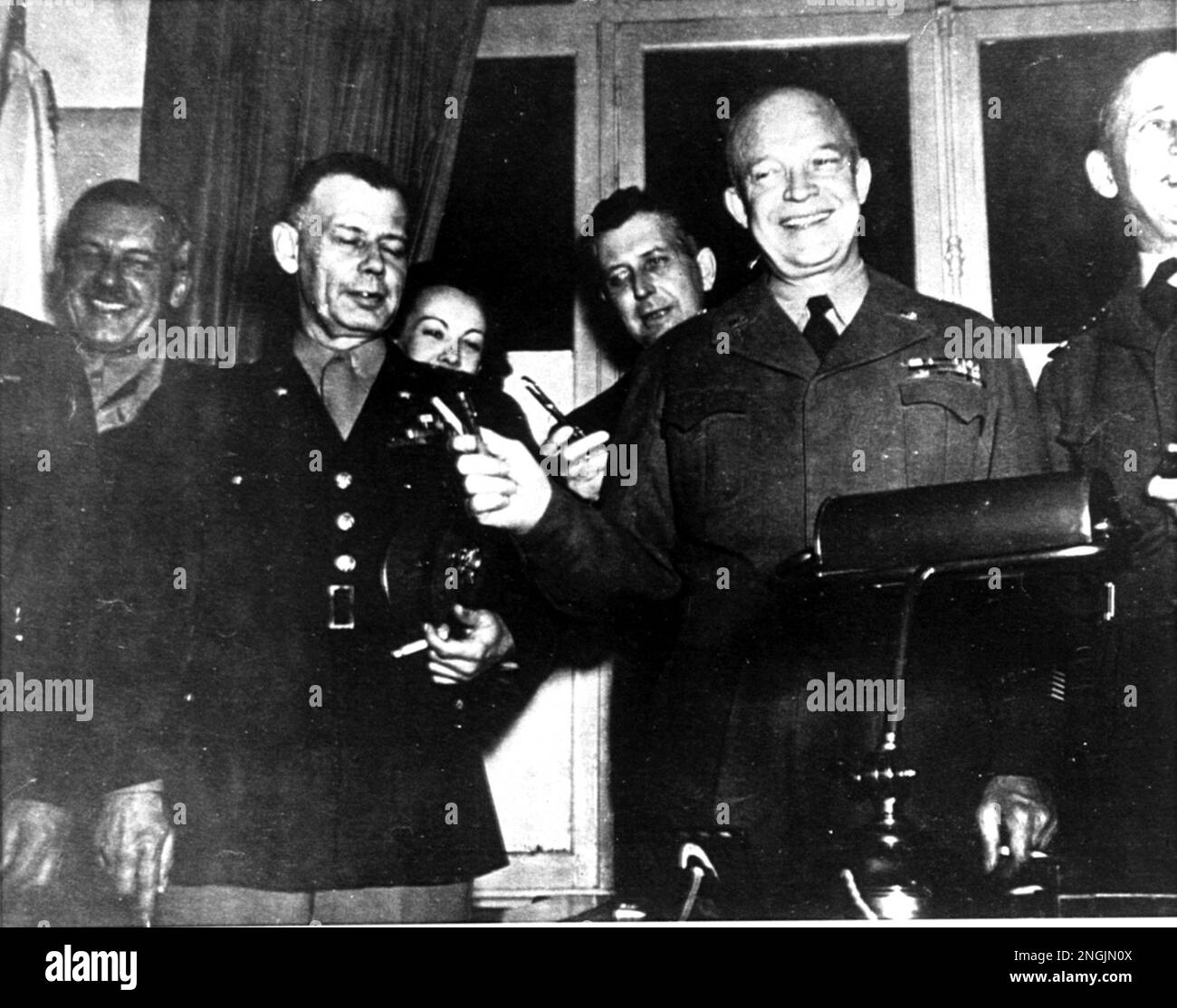 General Dwight D. Eisenhower holds up a V-for-Victory gesture with the ...