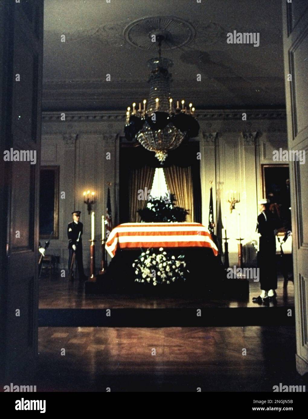 The flag-draped casket of slain President John F. Kennedy lies in ...