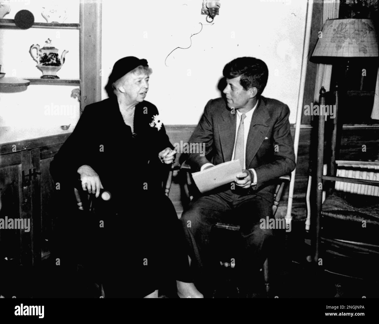 Congressman John F. Kennedy is shown talking to Eleanor Roosevelt, in ...