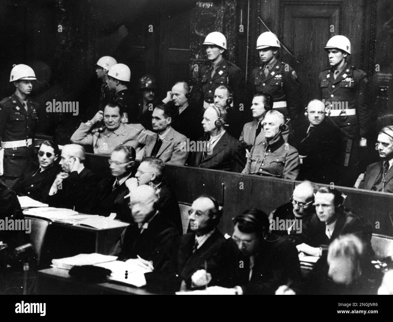 Nazi war criminals are seated in the defendants box in the courtroom at ...
