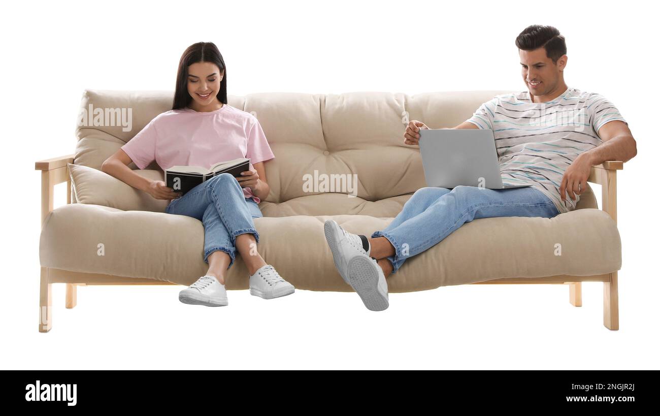 Happy couple sitting on sofa Cut Out Stock Images & Pictures - Alamy