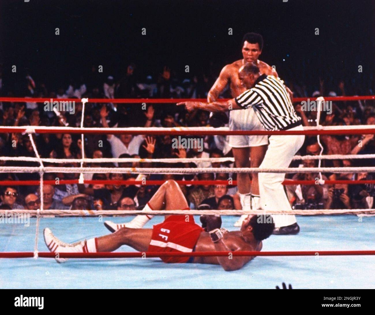 Challenger Muhammad Ali is directed to a neutral corner by referee Zack ...