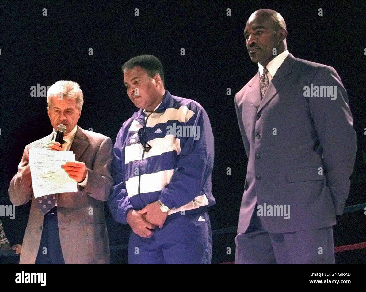 Sig Rogich, left, a representative for Mike Tyson, reads a statement ...