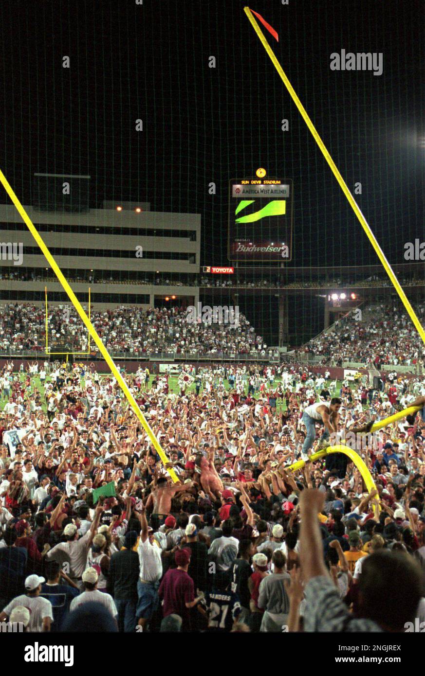 Arizona Cardinals fans storm the field and tear down the goal post in ...
