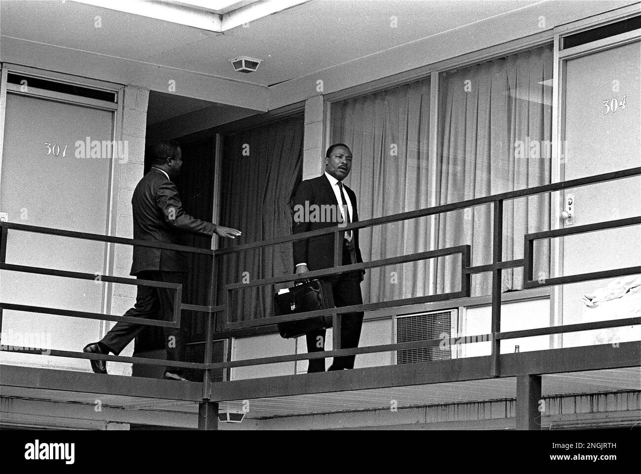 Rev. Martin Luther King, Jr. is pictured walking across the balcony of ...