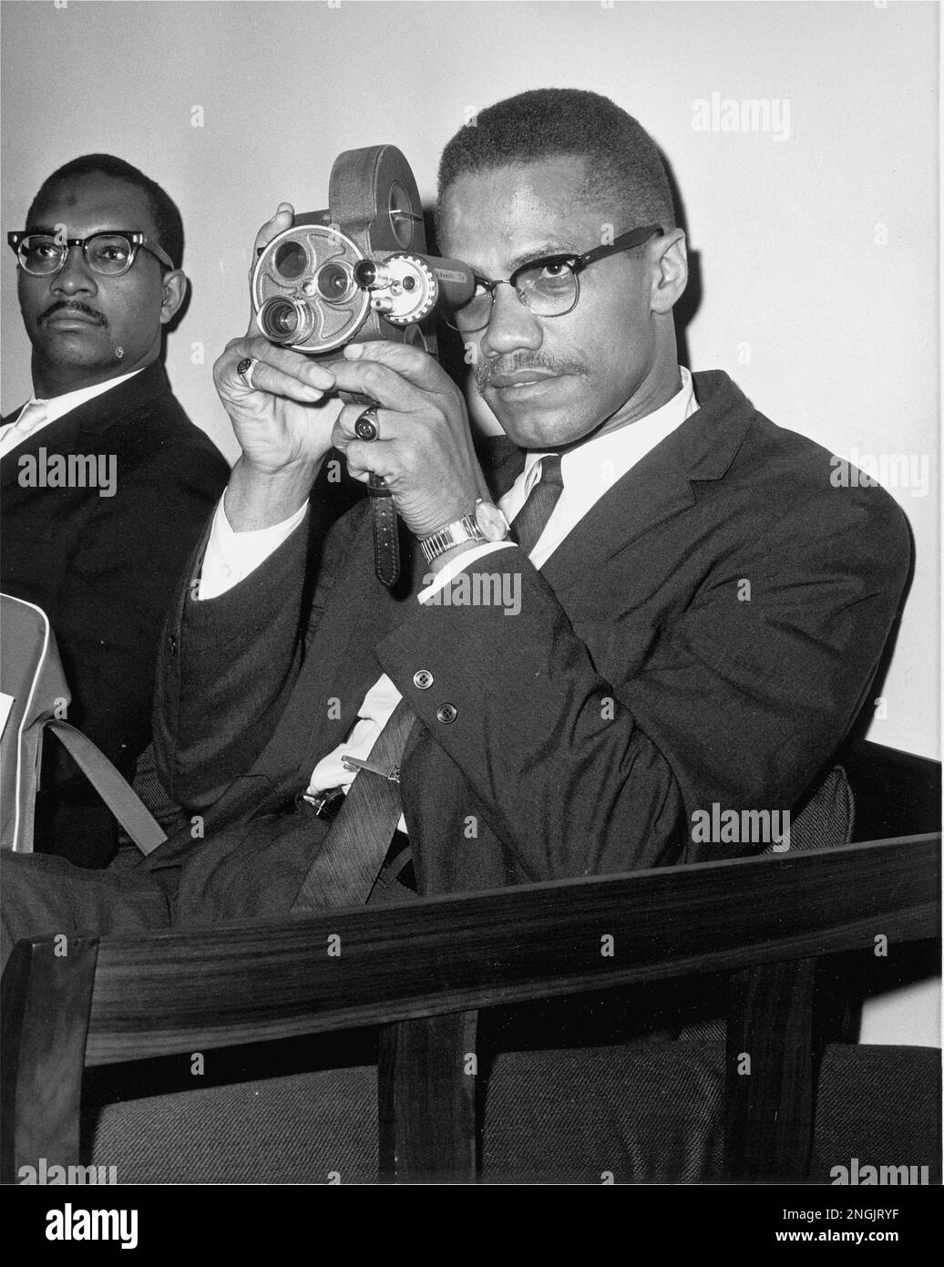 Malcolm X, black nationalist leader, is shown with his 16mm Bell and ...
