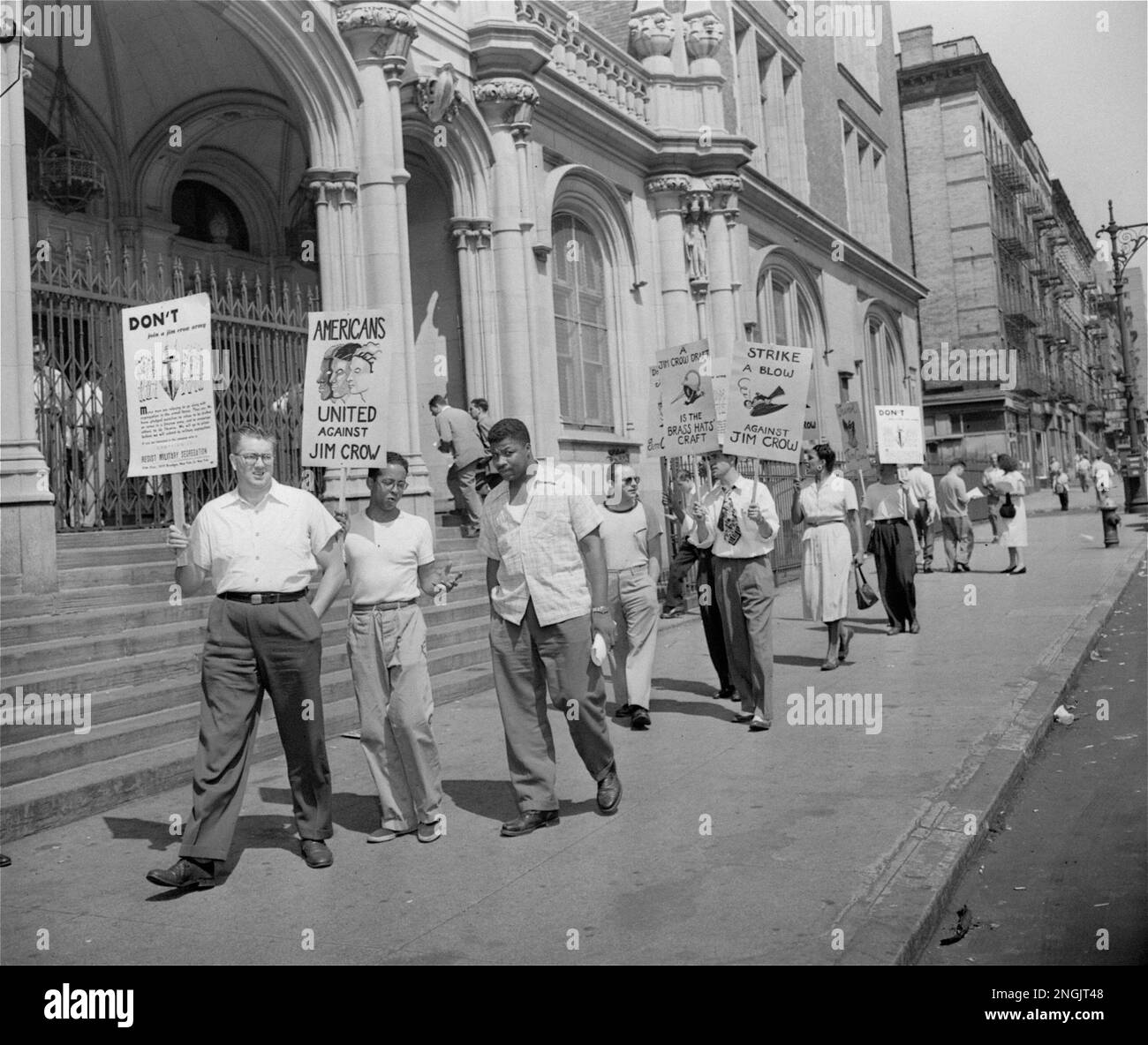 Pickets carrying placards bearing anti-draft slogans parade in front of ...