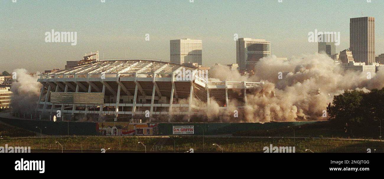 Explosive charges weaken the structure of the Fulton County Stadium ...