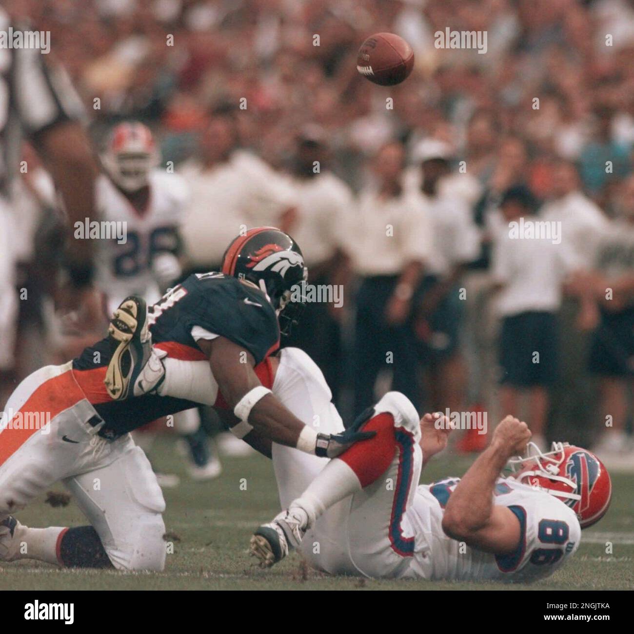 Denver Broncos linebacker John Mobley, left, breaks up a pass intended ...