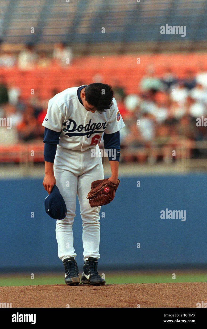 Los Angeles Dodgers' Chan Ho Park bows after taking the mound before a ...
