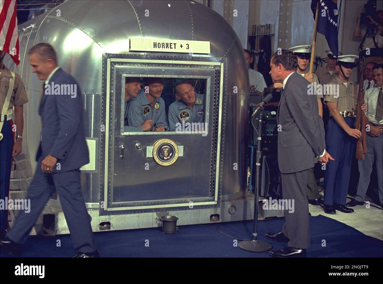 President Richard Nixon looks at the Apollo 11 astronauts in the ...