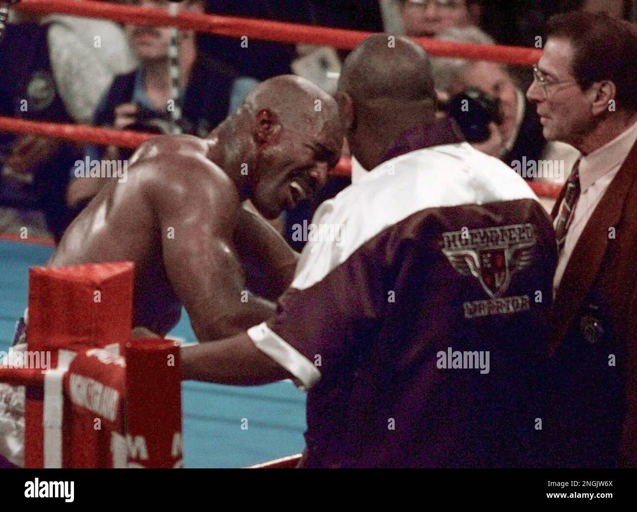 Evander Holyfield reacts after he was bit in the ear by Mike Tyson in ...
