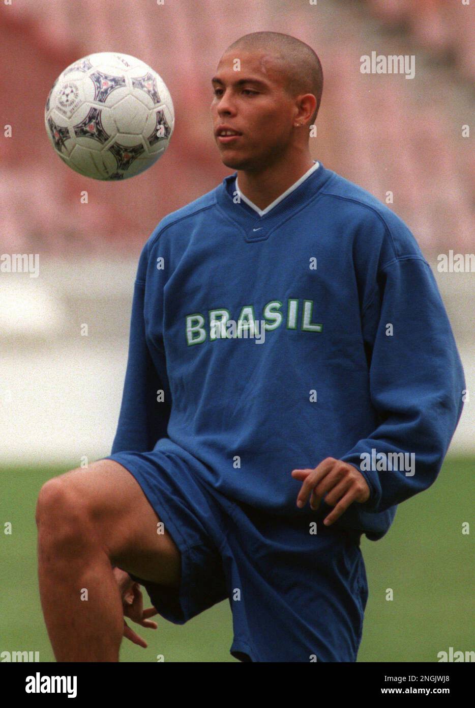Brazilian soccer player Ronaldo juggles the ball during a training ...