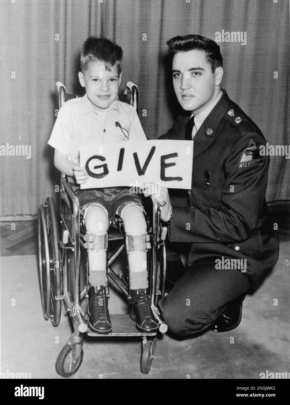 Pfc. Elvis Presley and tiny polio victim Robert Stephen Marquette ...