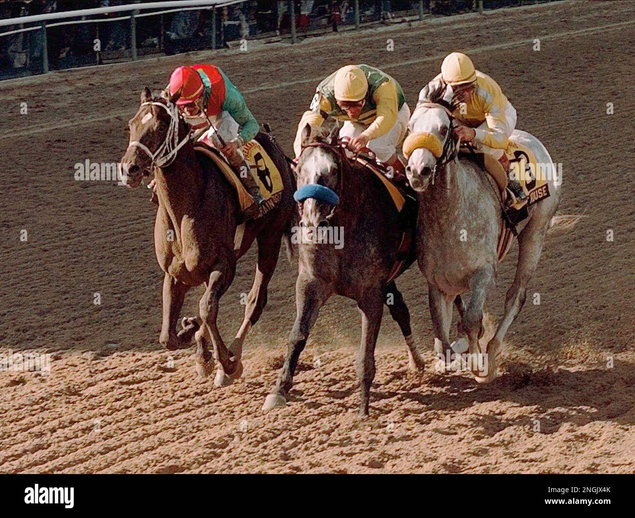 Jockey Gary Stevens aboard Silver Charm, center, edges Captain Bodgit ...