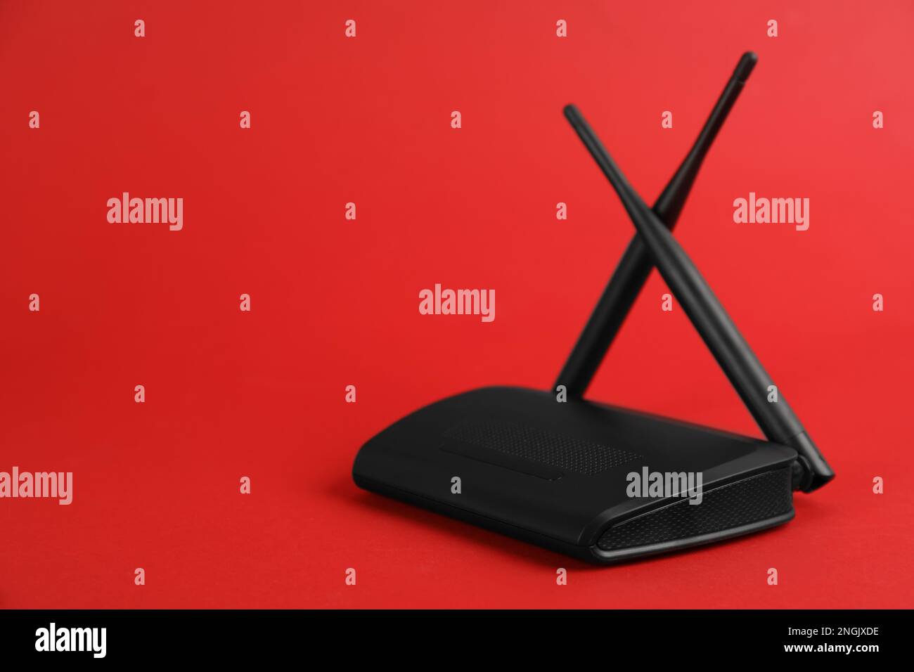 Modern Wi-Fi router on red background. Space for text Stock Photo - Alamy